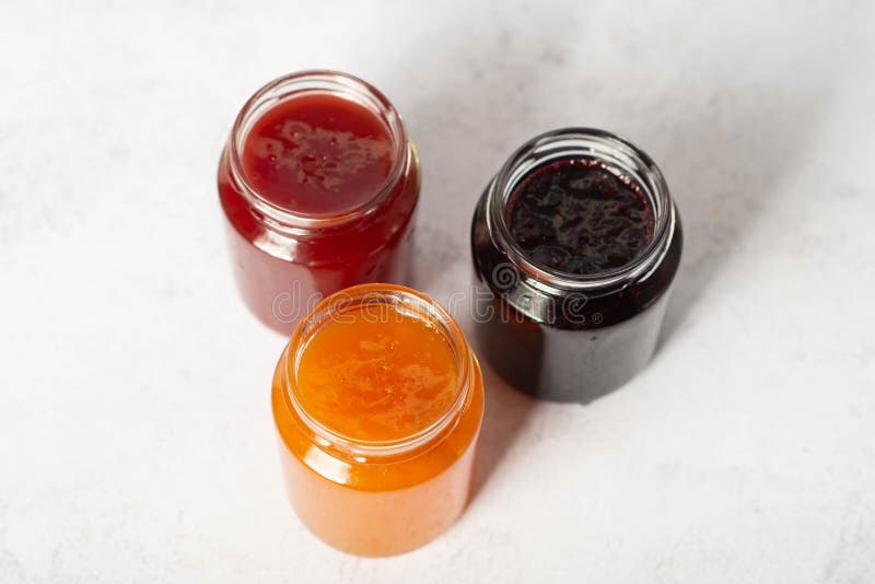 Front View of Set of Small Jam and Vegetable Jars in Different Colors ...