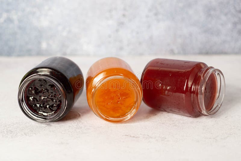 Front View of Set of Small Jam and Vegetable Jars in Different Colors ...