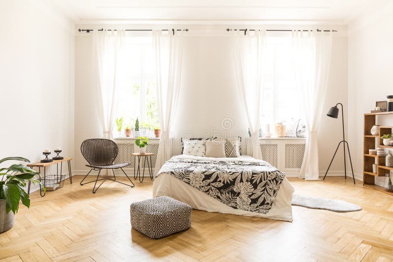Front View of a Simple Bedroom Interior with a Bed, Pouf, Window Stock ...