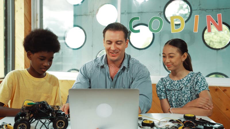 Front View of Smart Teacher Explain by Using Laptop with Car Model ...