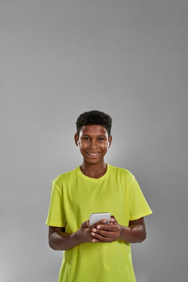 Front View of Smiling Black Boy Using Smartphone Stock Photo - Image of ...