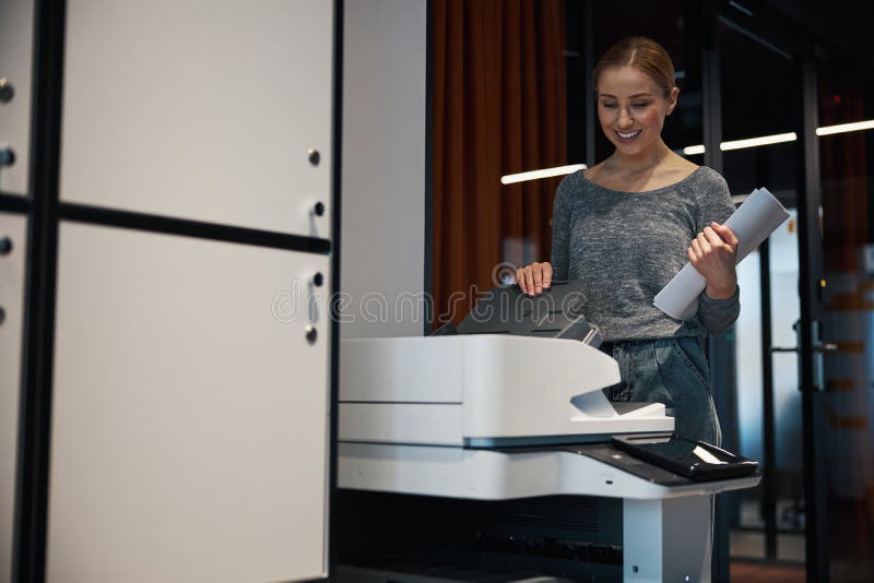 Cheerful Office Assistant Preparing Papers for Printing Stock Image ...