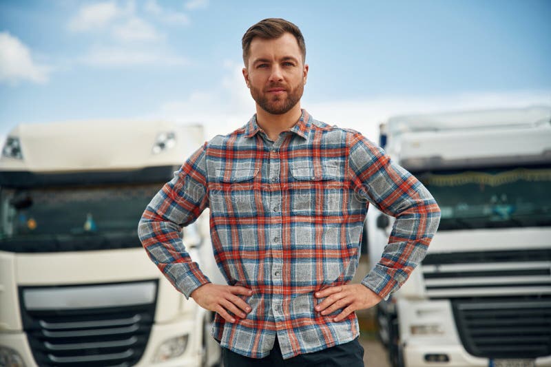 Front View, Standing. Man is Standing Against Trucks Outdoors Stock ...