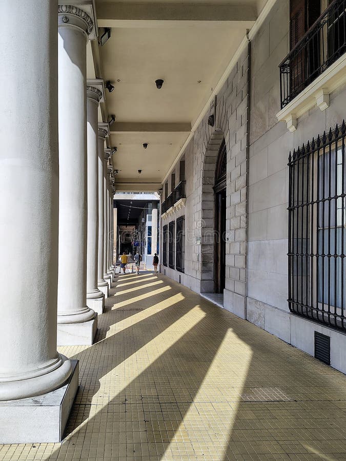 Sunlit Columned Corridor with Shadows Editorial Photo - Image of strong ...
