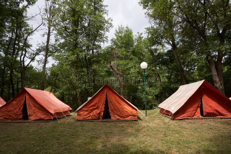 Front View of Three Orange Camping Tents Standing in Front of the ...