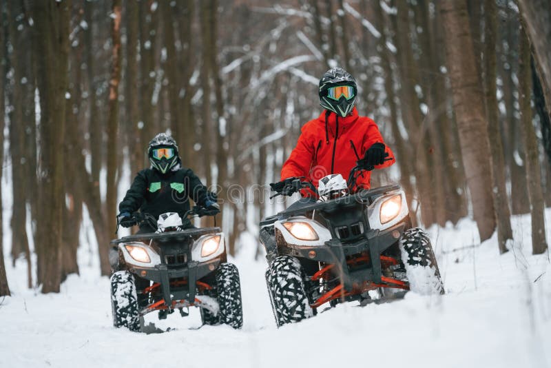 Front View. Two People are Riding ATV in the Winter Forest Stock Image ...