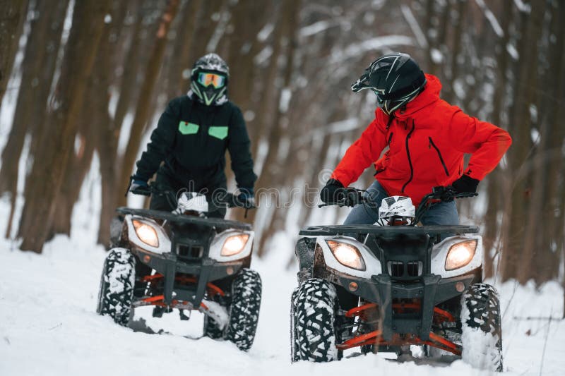 Front View. Two People are Riding ATV in the Winter Forest Stock Image ...