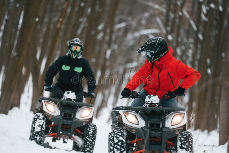 Front View. Two People are Riding ATV in the Winter Forest Stock Image ...