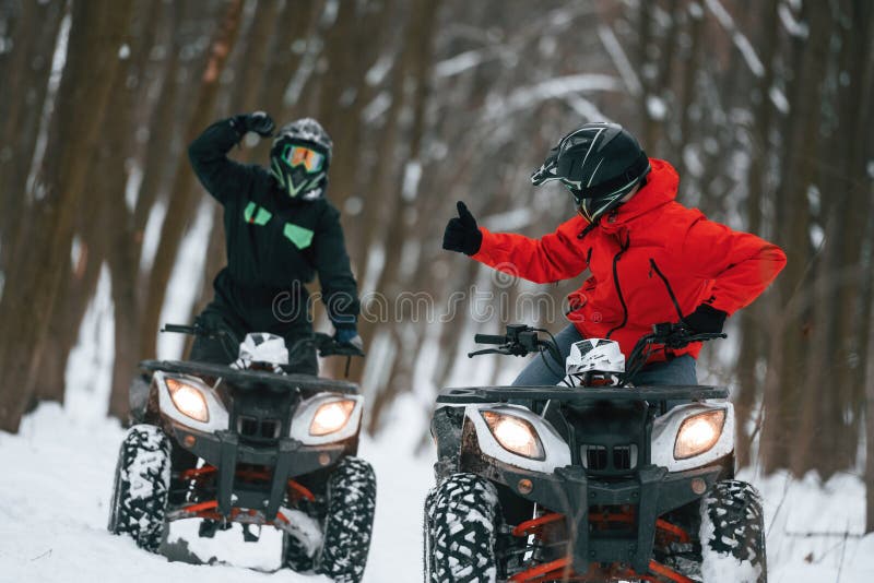 Front View. Two People are Riding ATV in the Winter Forest Stock Photo ...