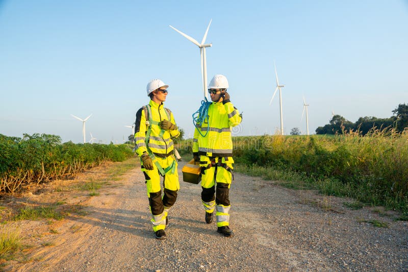 Front View Two of Wind Turbine or Windmill Workers or Technicians Carry ...