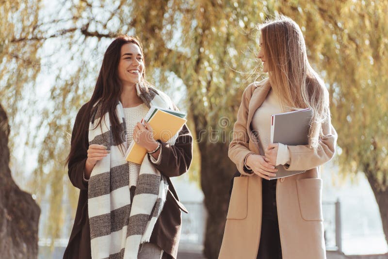 Front View. Two Young Friends are Glad To Meet Each Other at Park after ...