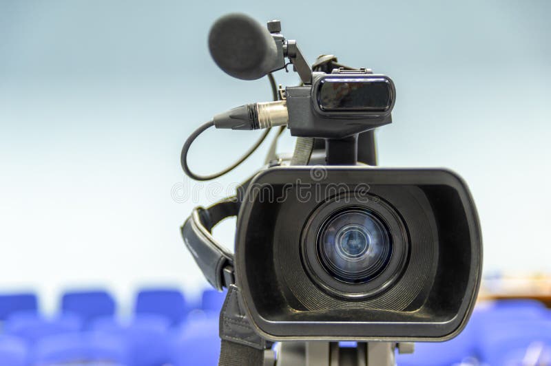Front View of Video Camera with Blurred Hall Background, Selective ...