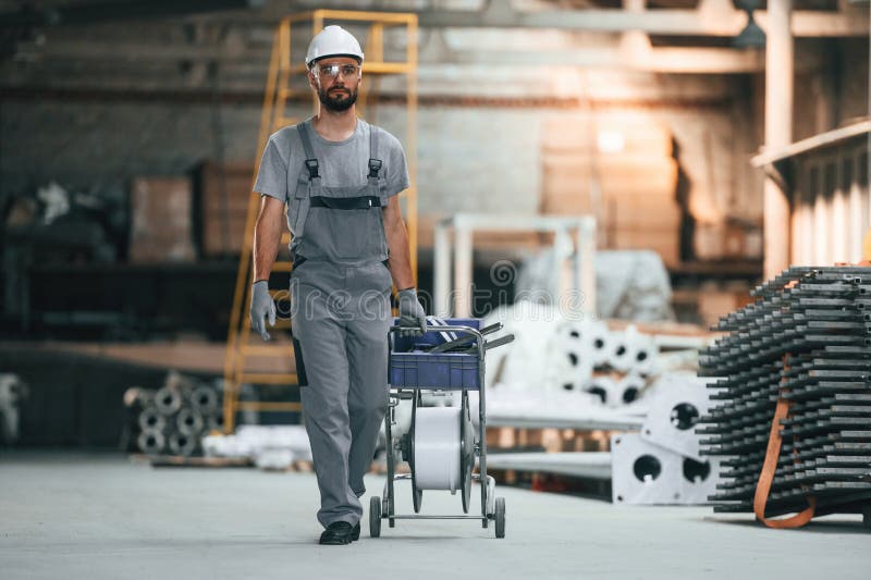 Front View, Walking Forward. Young Factory Worker in Grey Uniform Stock ...