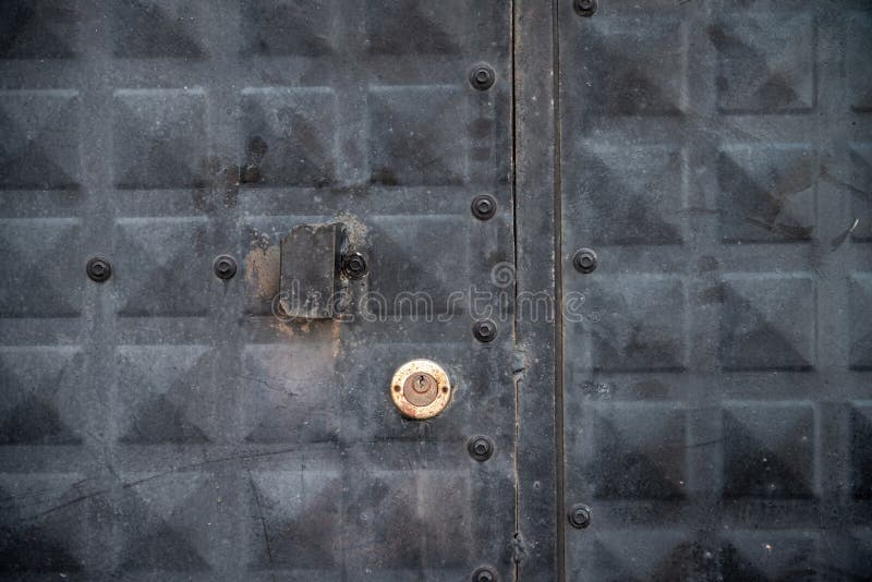 Front View of Weathered Black Iron Door with Keyhole and Lock Stock ...