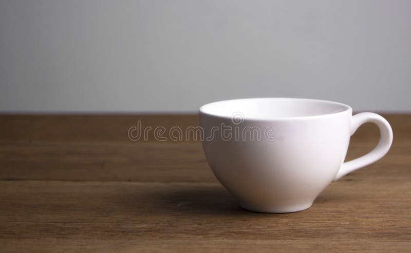 Front View of White Ceramic Coffee Cup on a Brown Rustic Wooden Table ...