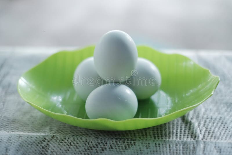 Front View of White Salted Eggs in a Stack of Plates. Stock Photo ...