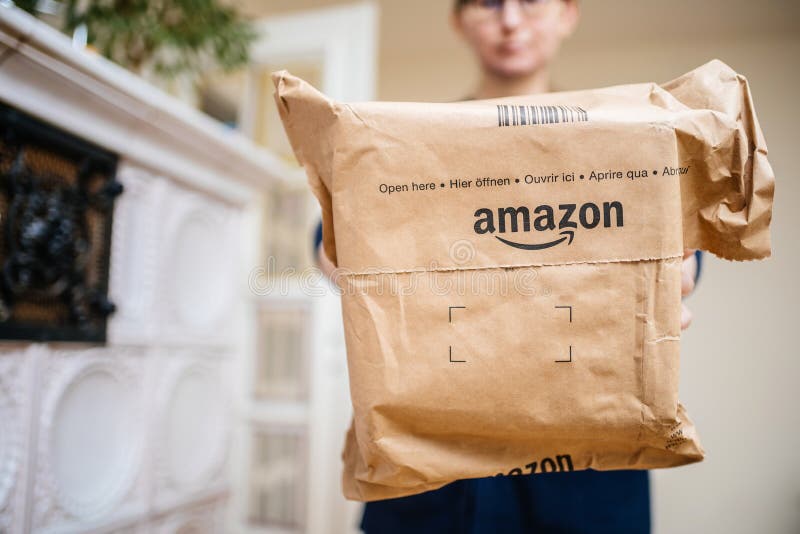 Front View of Woman Holding New Design for the Amazon Prime Package ...