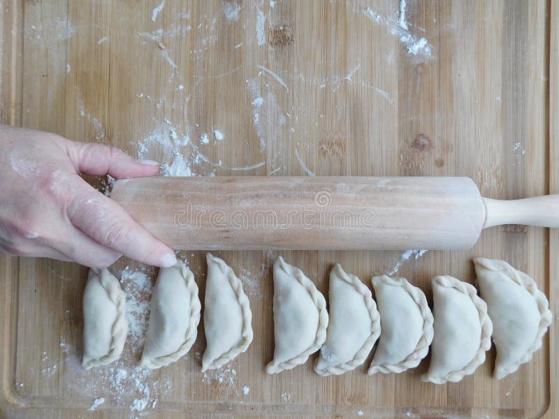 Front View of Woman S Hands Making Meat Dumpling with Wooden Rolling ...