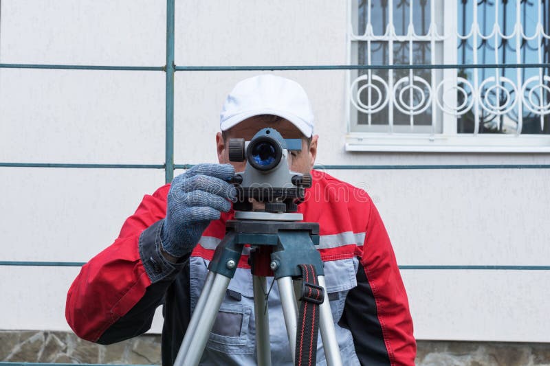 Front View of Worker in Red Workwear Looks in Engineering Level. Stock ...