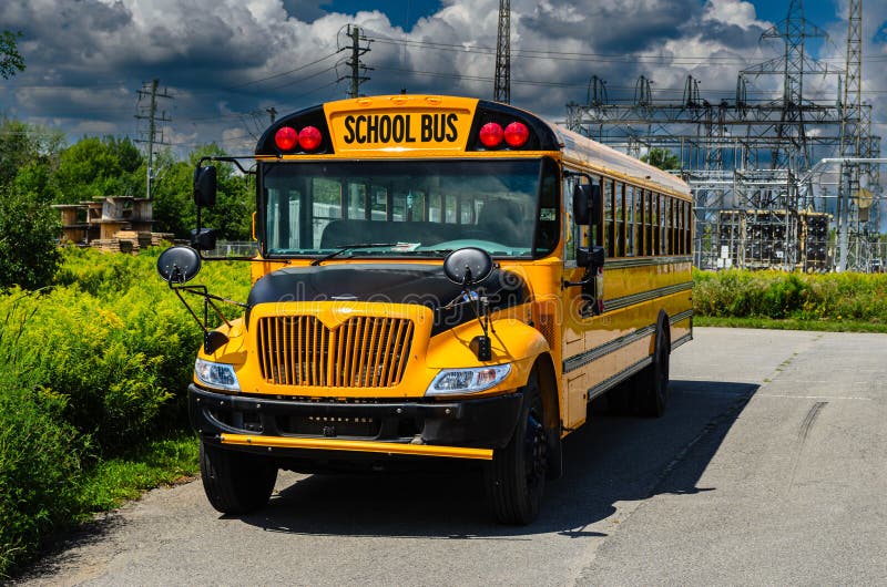 Front View of a Yellow School Bus Parked in Front of a Hydro Sub ...