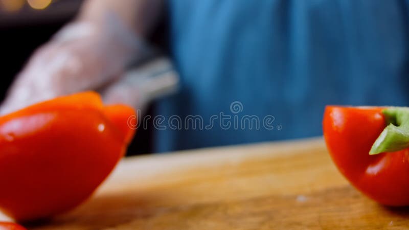 Front View of the Young Chef Cut Thin Slices of a Piece of Red Pepper ...