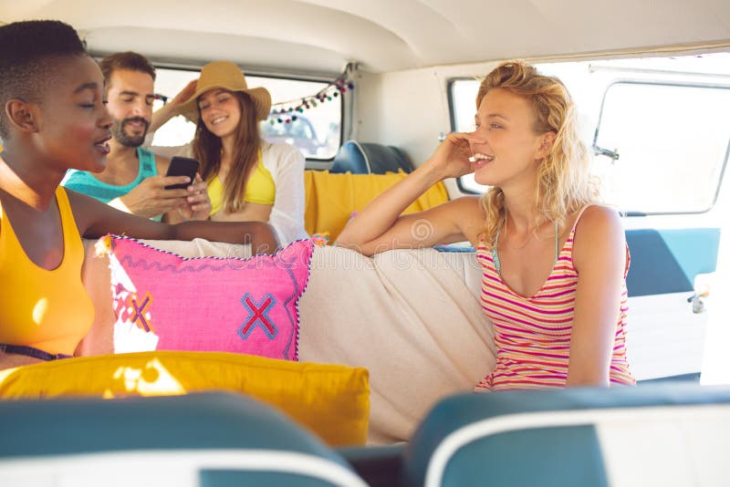 Group Of Friends Having Fun In A Camper Van At Beach Stock Photo ...