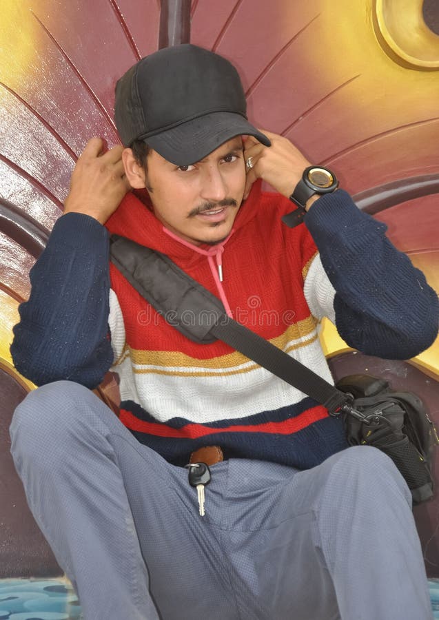 Front View of a Young Guy Looking at Camera while Adjusting Hoodie ...