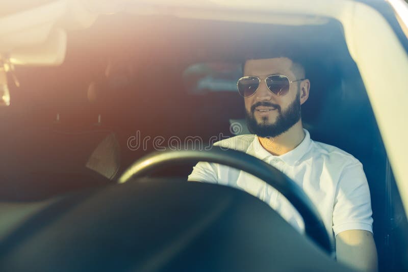 Front View, Young Handsome Man Looking Straight while Driving a Car ...