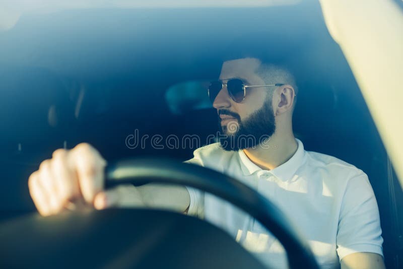 Front View, Young Handsome Man Looking Straight while Driving a Car ...