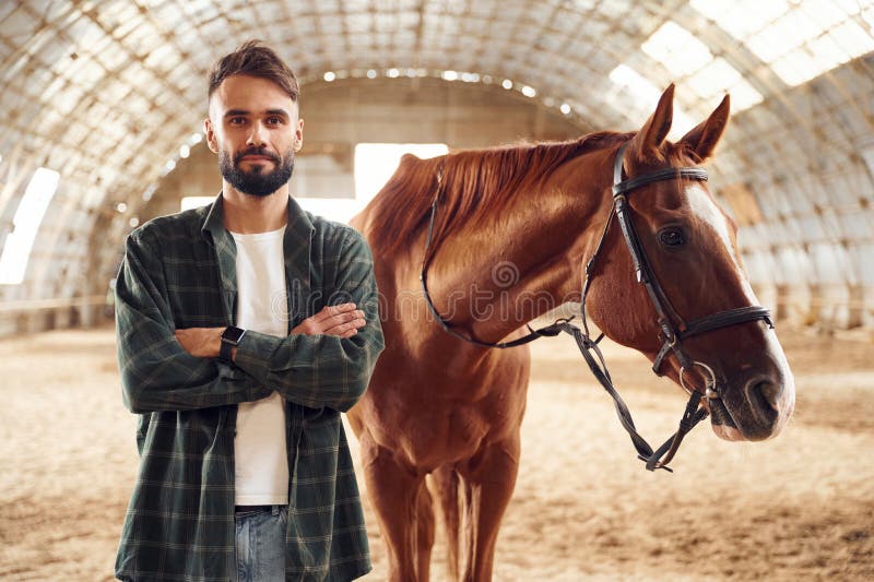Front View. Young Man with a Horse is in the Hangar Stock Image - Image ...