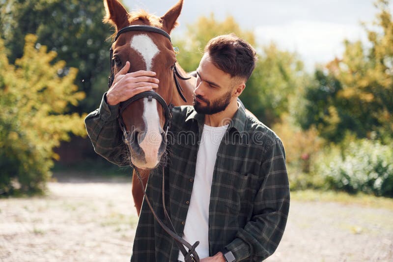 Front View. Young Man with a Horse is Outdoors Stock Image - Image of ...