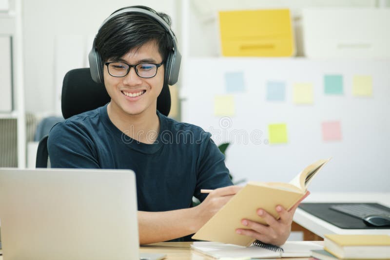 Young Man Study in Front of the Laptop Computer at Home Stock Photo ...
