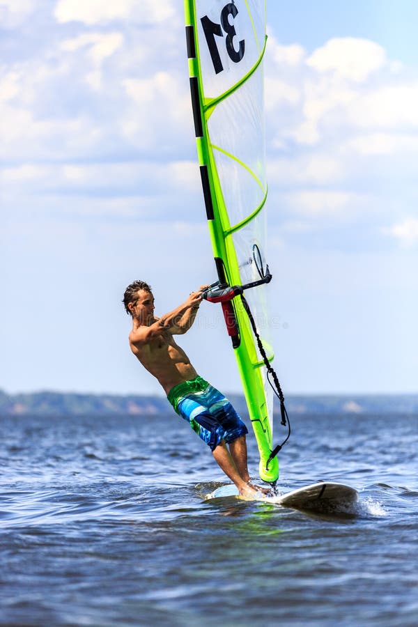 Front View of Young Windsurfer Stock Photo - Image of recreational ...