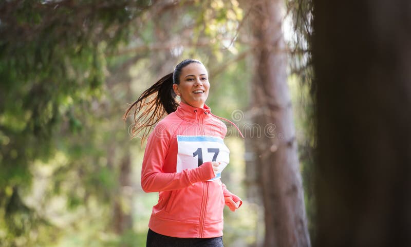 Front View of Young Woman Running a Race Competition in Nature. Stock ...