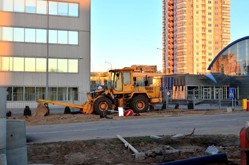Front Wheel Loader Working on the Working Platform on the Street during ...