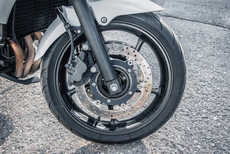 The Front Wheel of a Racing Motorcycle on the Road Stock Image - Image ...