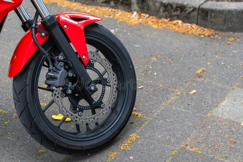 Front Wheel of a Red Motorcycle with Disc Brakes. Stock Photo - Image ...