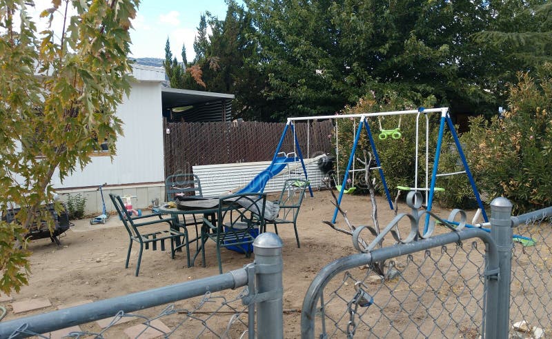 Front yard swingset stock photo. Image of daytime, swingset - 163606338