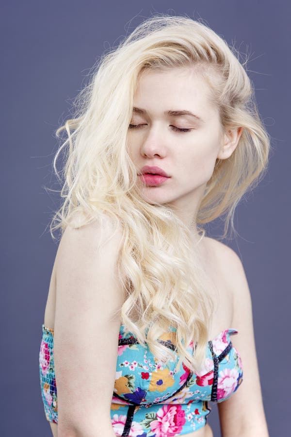 Frontal Portrait of Beautiful Blond Young Woman Face Posing with Closed ... Frontal Portrait of Beautiful Blond Young Woman Face Posing with Closed ...