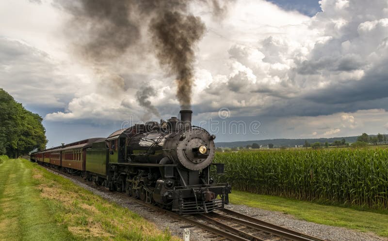 Frontal View of Antique Passenger Train Approaching Blowing Black Smoke ...