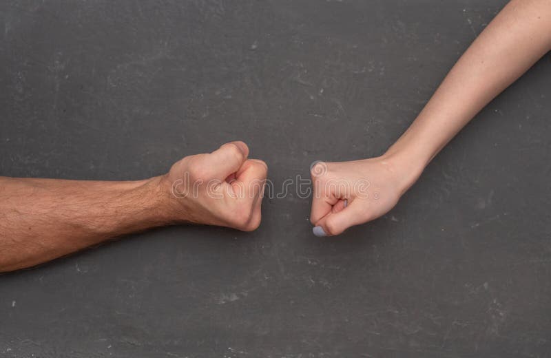 Frontal View of Interlocked Fists Creating Perfect Symmetry. Gray ...
