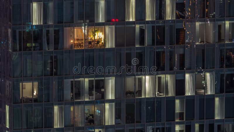 Frontal View of Night Facade of Building with a Lot of Windows with ...