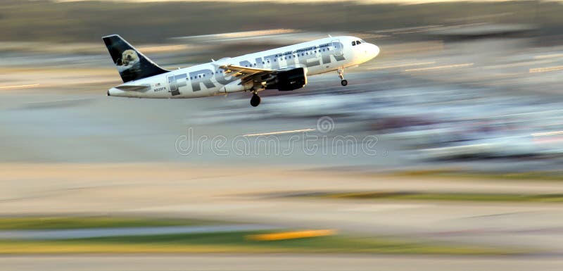 Frontier Airplane in Motion Flying Editorial Image - Image of cockpit ...