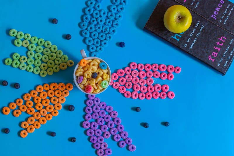 Froot Loops on Blue Table in Pattern, Blue, Pink, Yellow and Purple ...