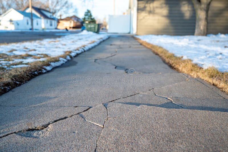 Frost Heave Crack in Residential Concrete Sidewalk Stock Image - Image ...