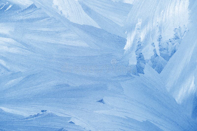 Frost Patterns on Window Glass in Winter. Frosted Glass Texture. Blue ...