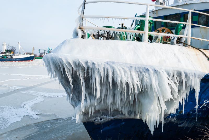 Frost Ship in Port on a Winter Day. Many Icicles are Frozen in the Bow ...