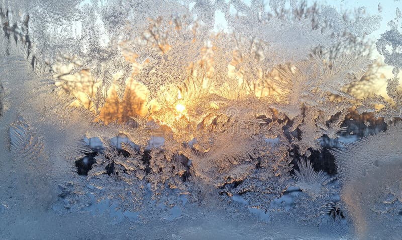 A Frosty Window with a Sun in the Background Stock Photo - Image of ...