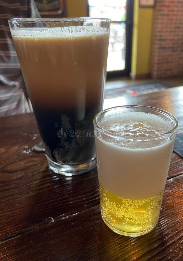 Frothy Beers in Glasses on a Wooden Countertop. Stock Photo - Image of ...