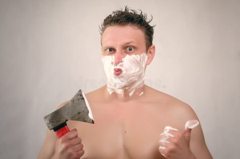 Man shaving by axe. stock photo. Image of shows, thumb - 129354836